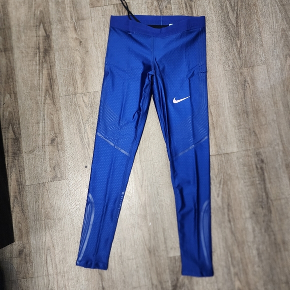 Nike | Pants & Jumpsuits | Nike Multi Bkue Colored Nike Drifit Reflective Ankle Zip Leggings ...